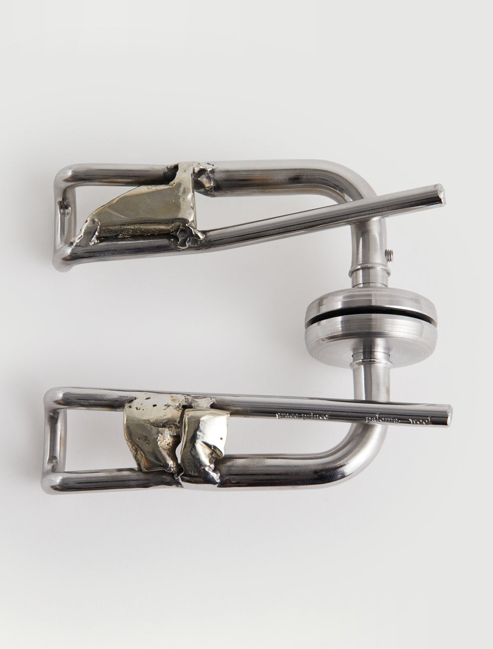ONE-Manually bent stainless steel door handle with a welded white ...