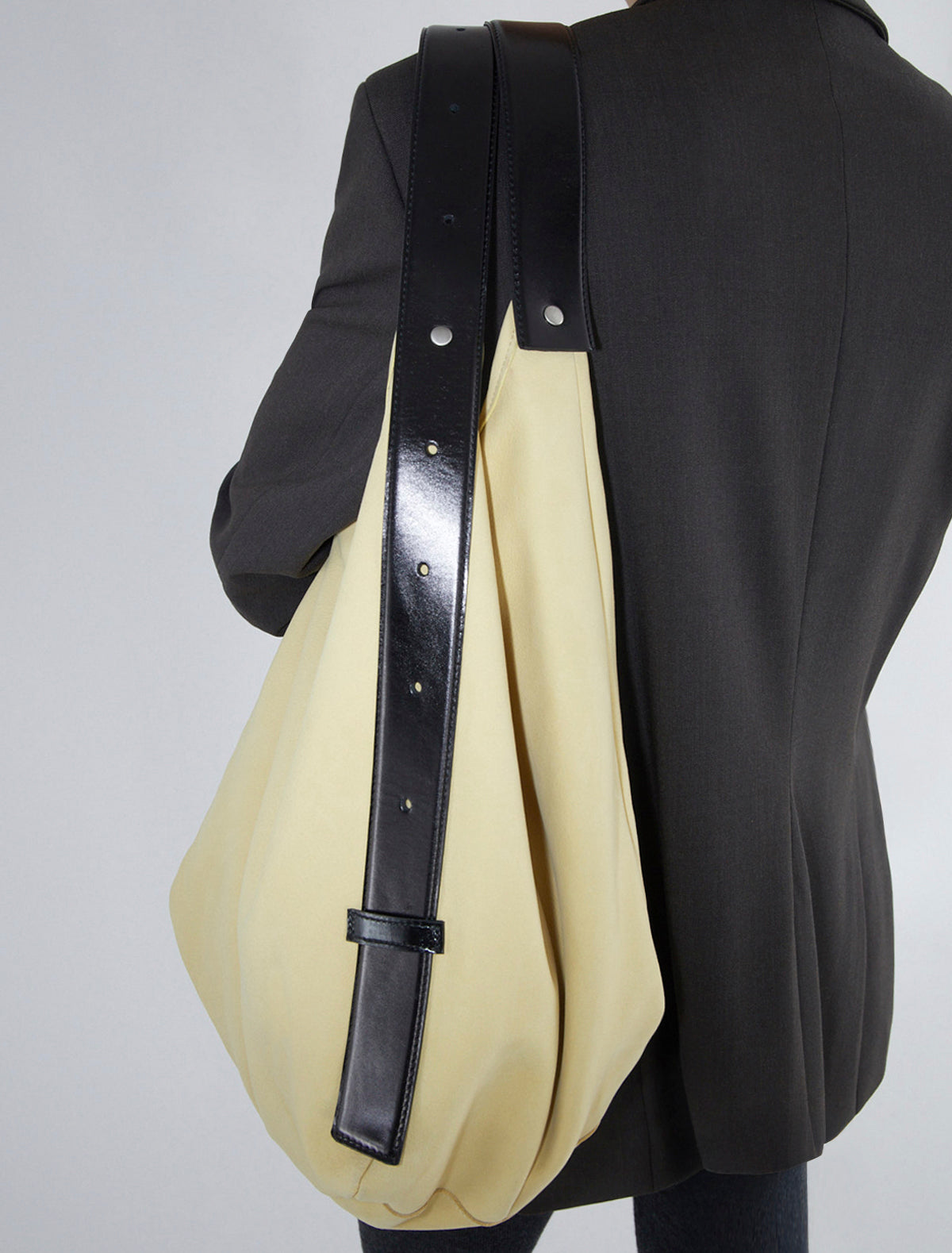BIG EMILIE BAG-Yellow big bucket bag featuring a belt-inspired handle ...
