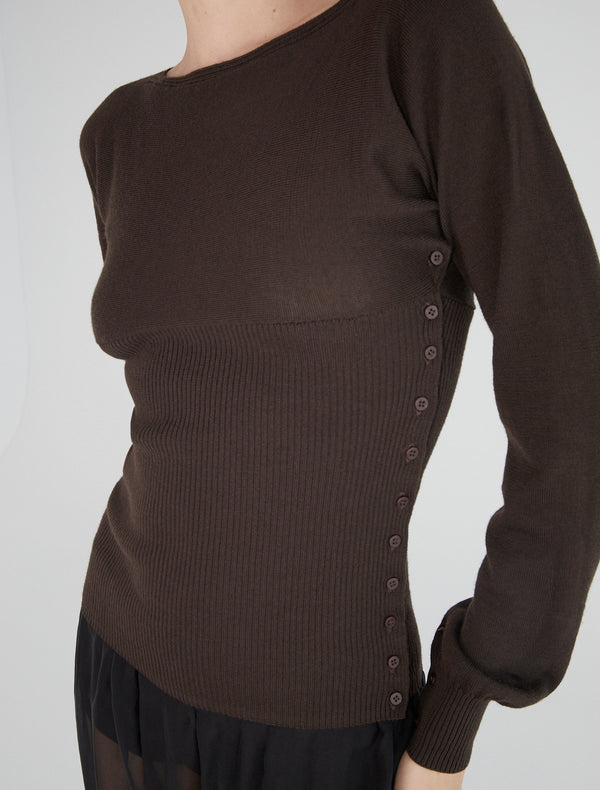 FA-Flat cross-shaped top with buttons along the sides and sleeves for ...