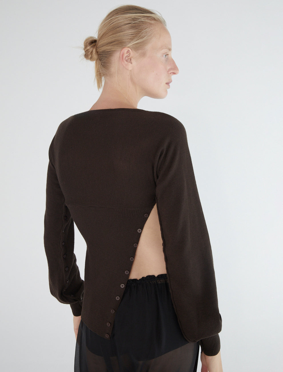 FA-Flat cross-shaped top with buttons along the sides and sleeves for ...