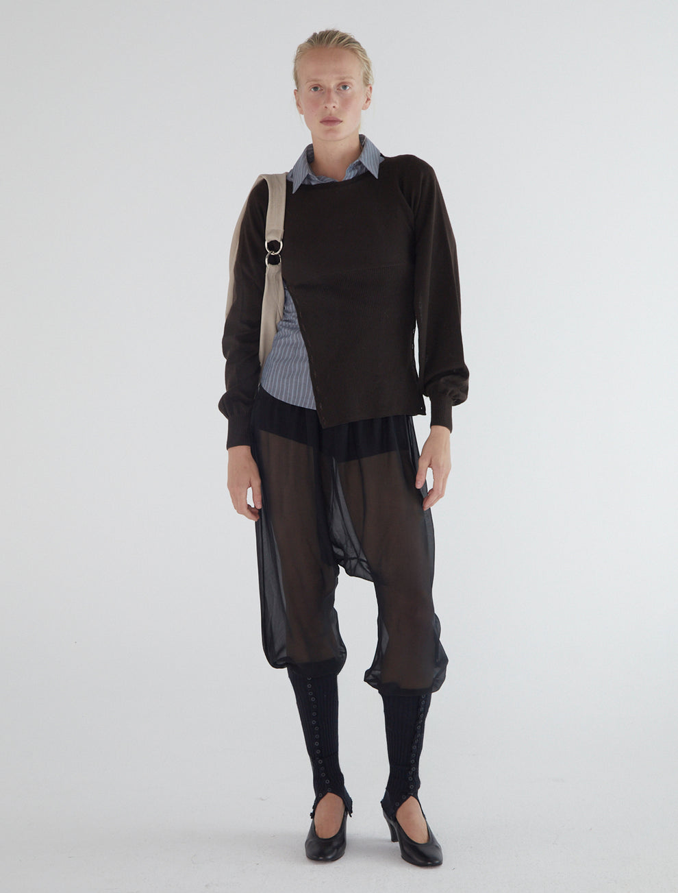 FA-Flat cross-shaped top with buttons along the sides and sleeves for ...